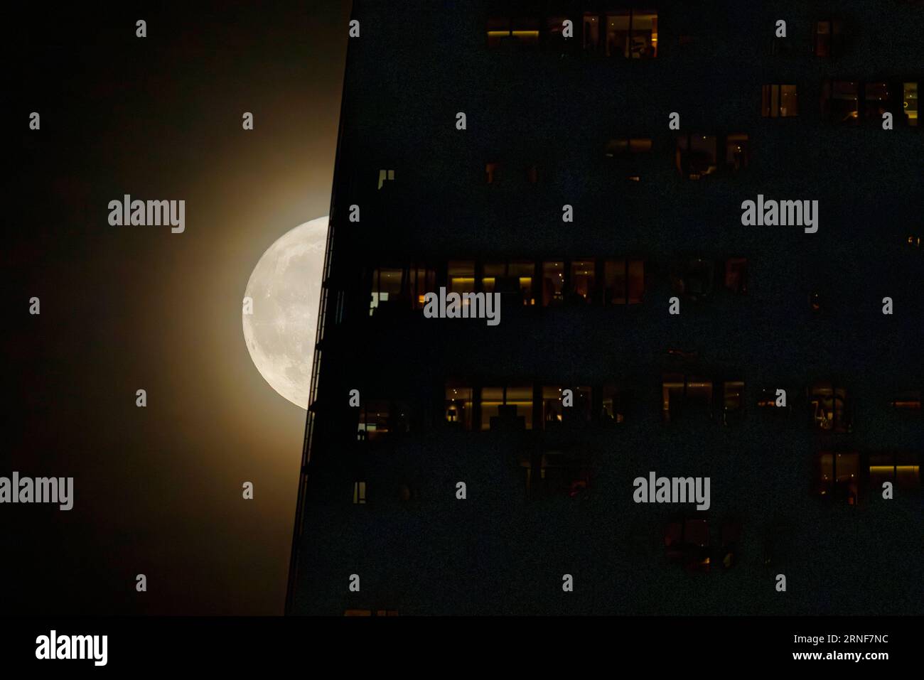 Blue super moon rises over The Shard in London. A ‘blue’ moon refers to ...