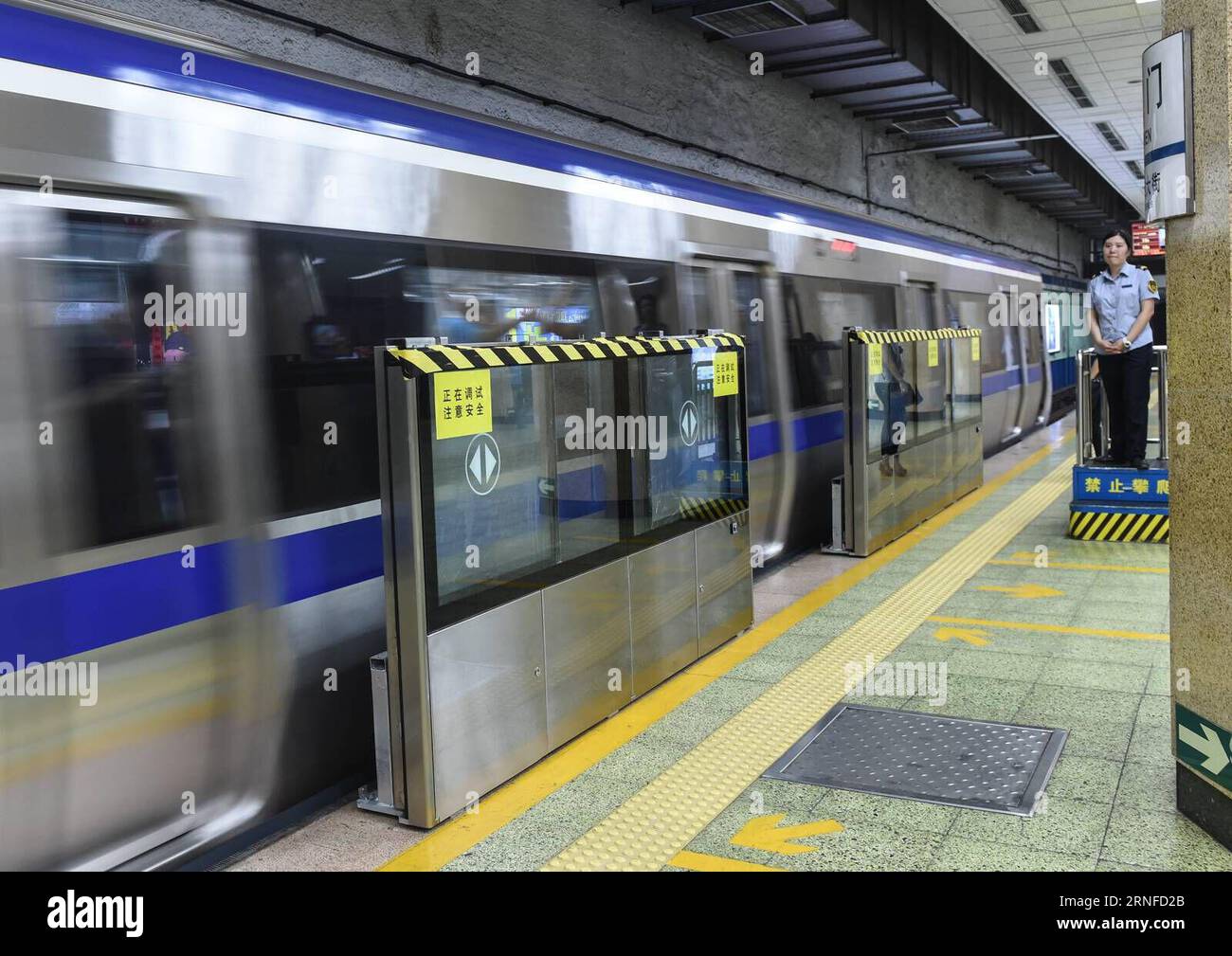BEIJING, A subway train passes by Andingmen Station of Beijing subway ...