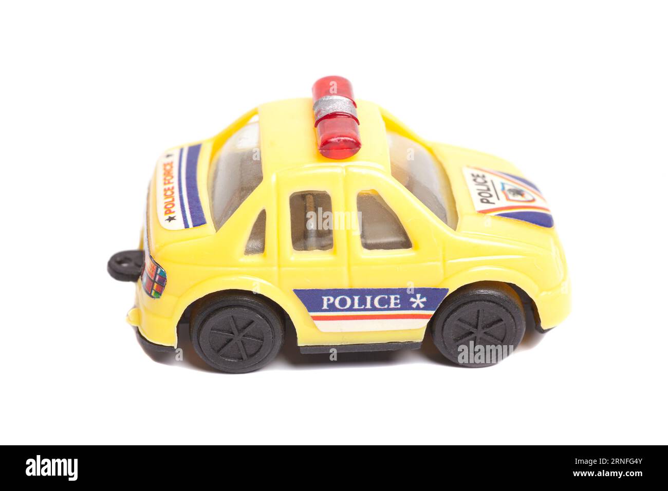 Yellow toy police car isolated on white background Stock Photo - Alamy