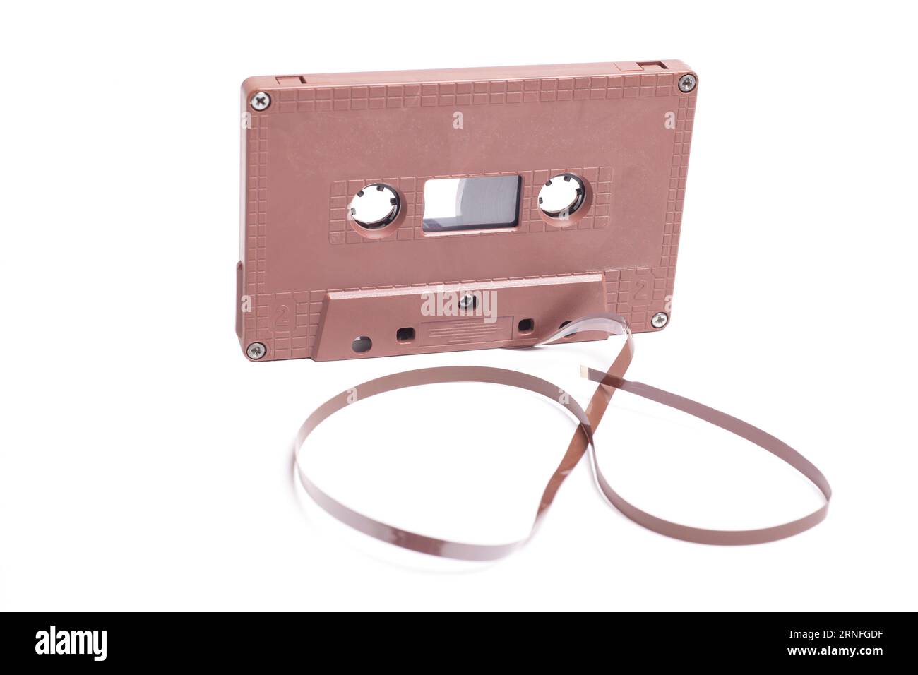 Audio cassette with pulled out audiotape isolated on white background ...