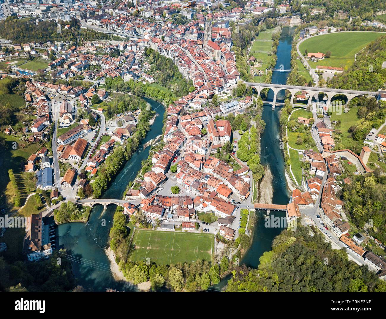Aerial view of the old town Fribourg and the curvy Sarine river meander ...