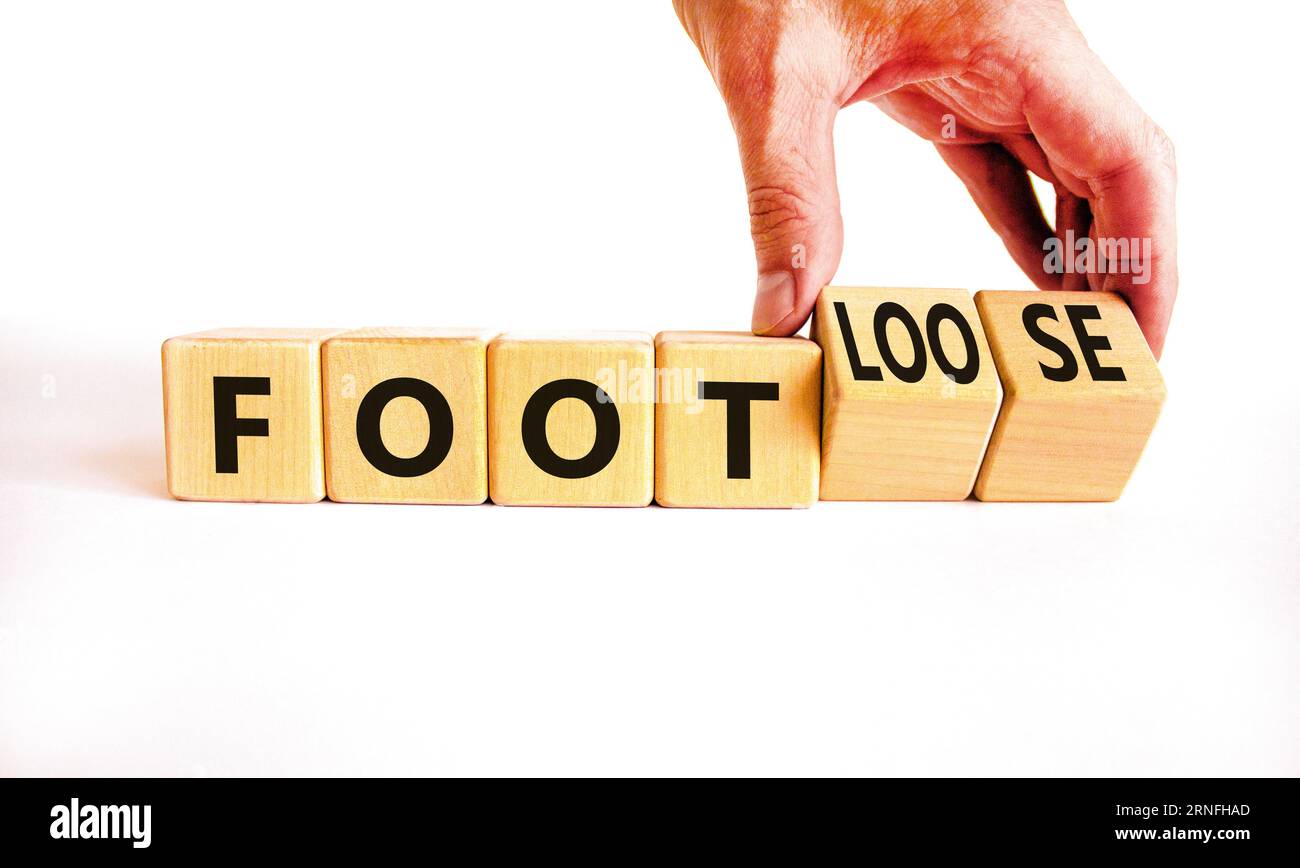 Foot or footloose symbol. Businessman turns wooden cubes and changes ...