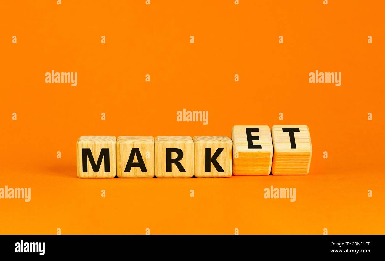 Mark of market symbol. Businessman turns wooden cubes and changes word ...