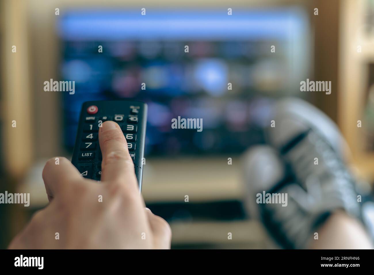 Unrecognizable Person Relaxing At Home Watching TV. View Streaming ...