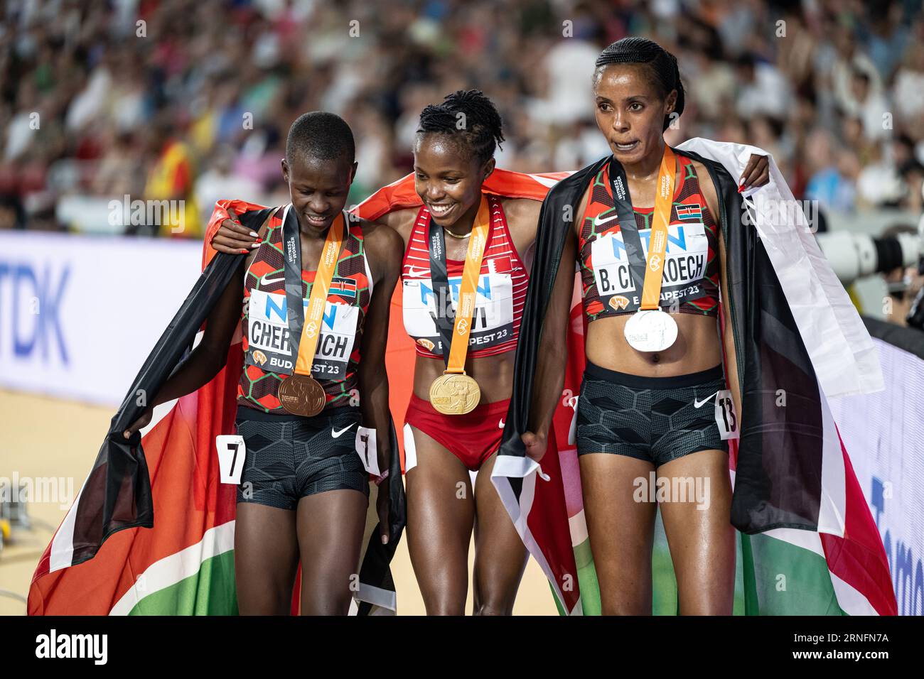 Winfred Mutile YAVI celebrating her victory with her country's flag in ...