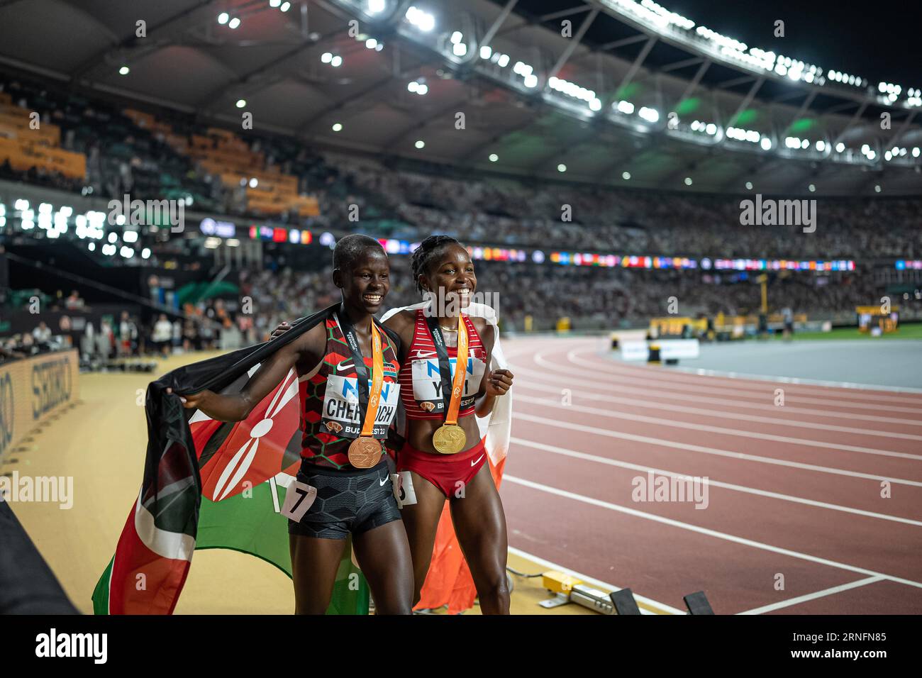 Winfred Mutile YAVI celebrating her victory with her country's flag in ...