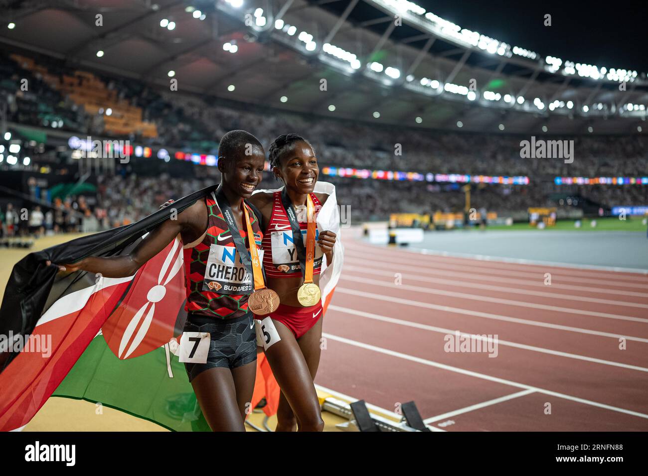 Winfred Mutile YAVI celebrating her victory with her country's flag in ...