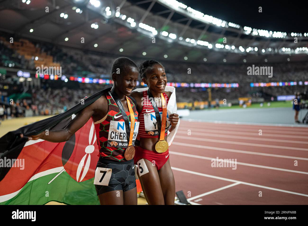 Winfred Mutile YAVI celebrating her victory with her country's flag in ...