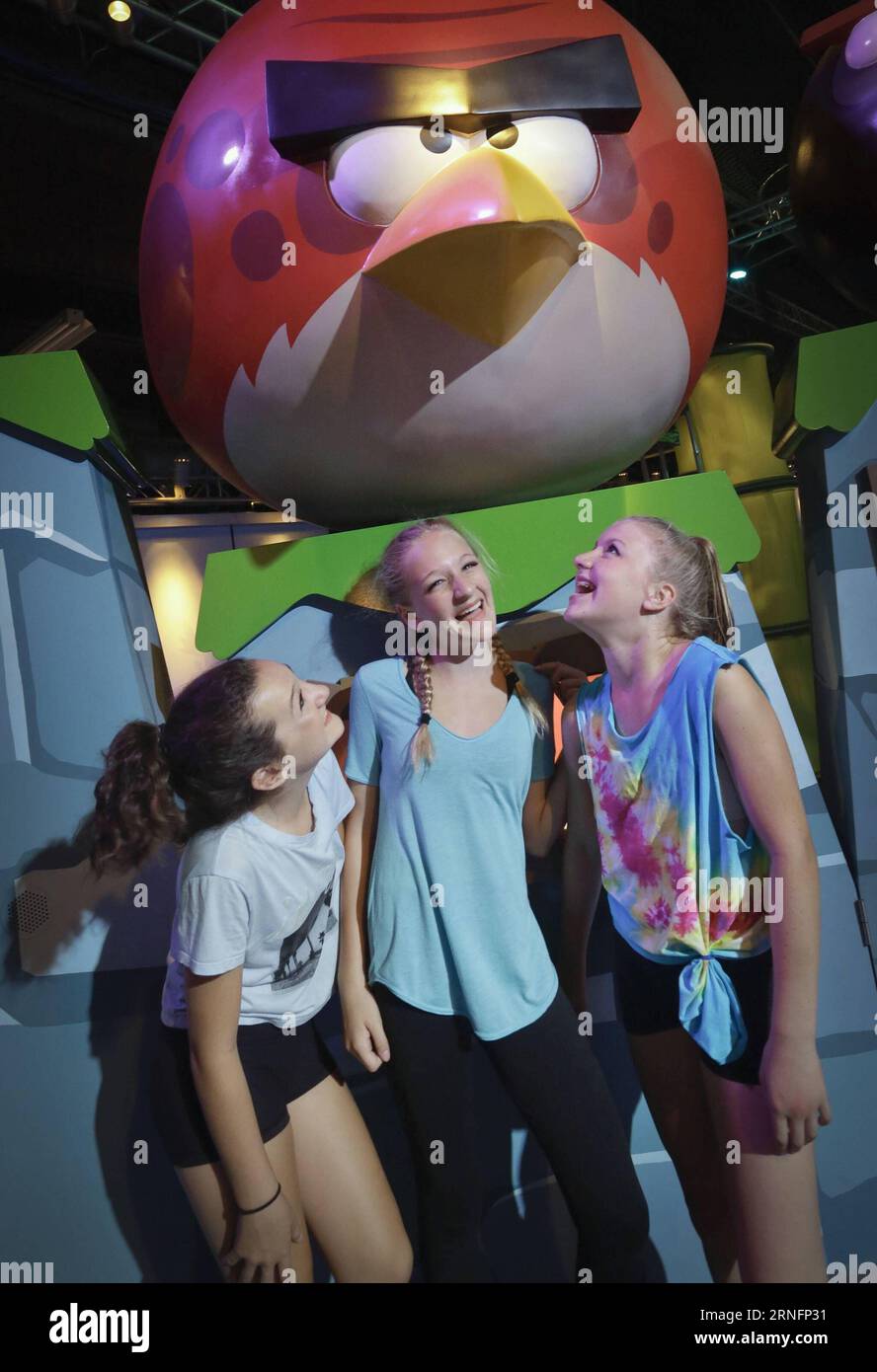 (160819) -- VANCOUVER, Aug. 19, 2016 -- Girls pose with an big Angry ...