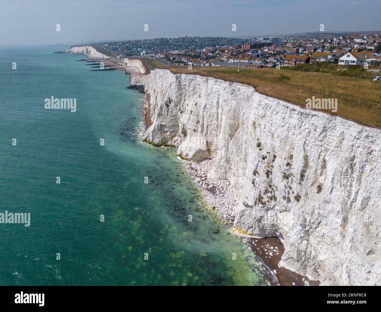 Aerial view of the chalk Telscombe Cliffs at Peacehaven, East Sussex ...