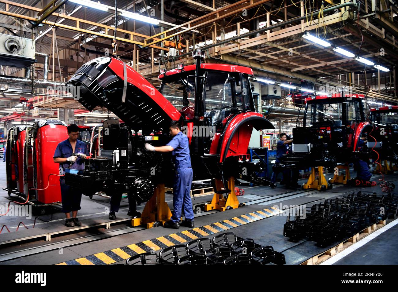 Workers produce Dongfanghong tractors in Luoyang, central China s Henan ...