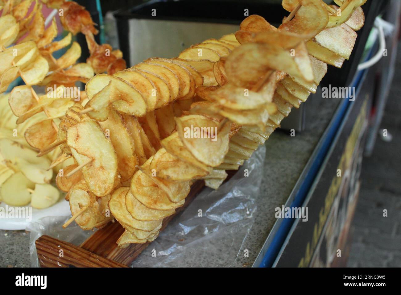 Street food: homemade potato chips cut into slices all around. Off-site ...