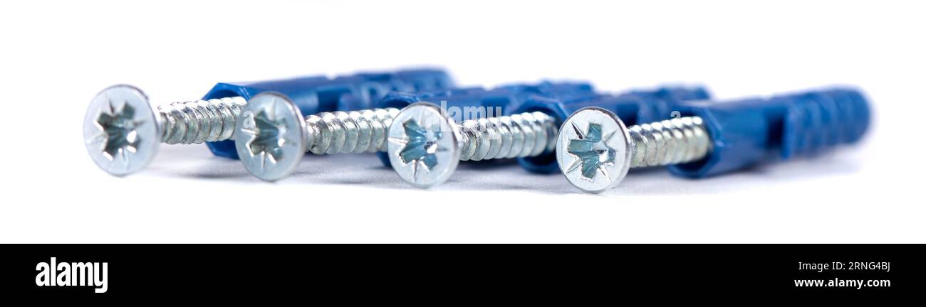 Chrome screws on white background. Self-tapping screws from steel close ...