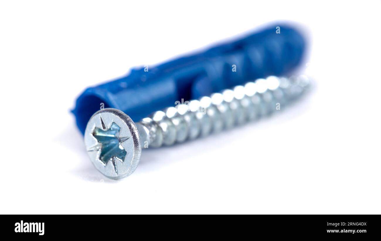 Metal screw and gray plastic dowel isolated on white background Stock ...