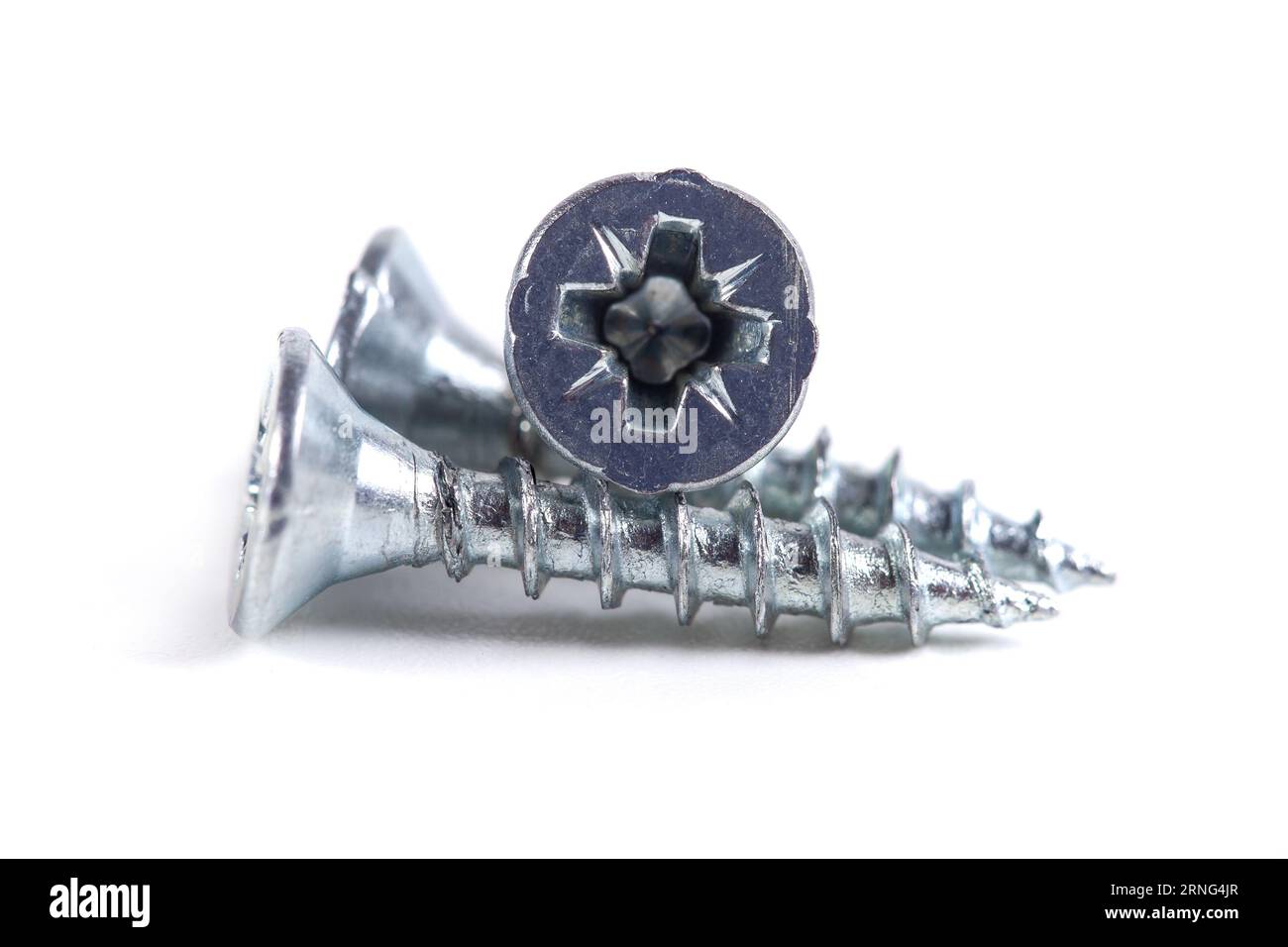 Chrome screw on white background. Self-tapping screws from steel close ...