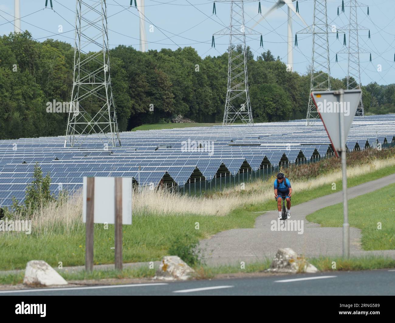 Large solar farm in Vlissingen, Zeeland, the Netherlands with cyclist ...