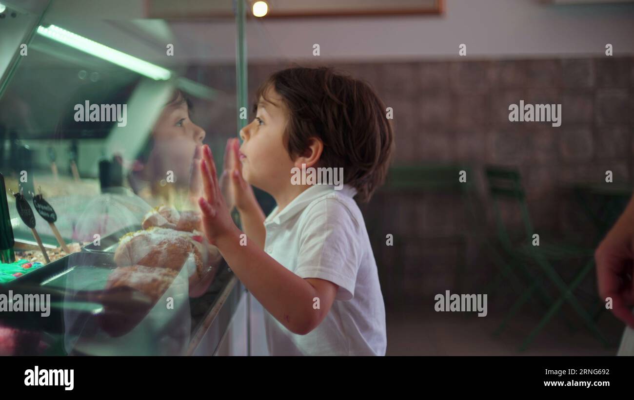 Child Leaning on Ice-Cream Glass Counter, Staring at Flavors, Childhood ...