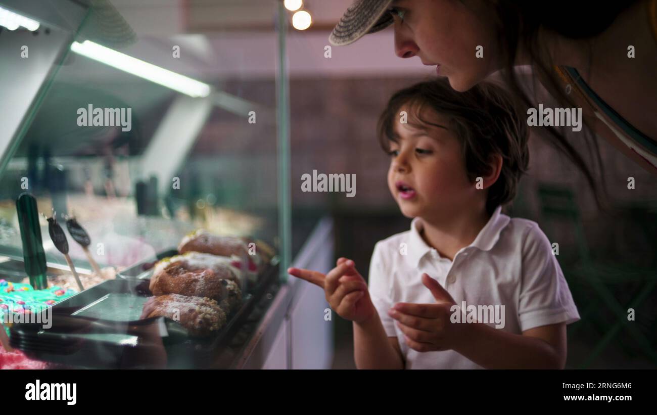 Small Boy Pointing at Ice-Cream Flavor, Choosing Dessert Behind Glass ...