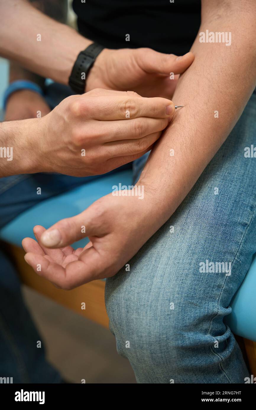 Patient undergoing neurological sensory testing in clinic Stock Photo ...