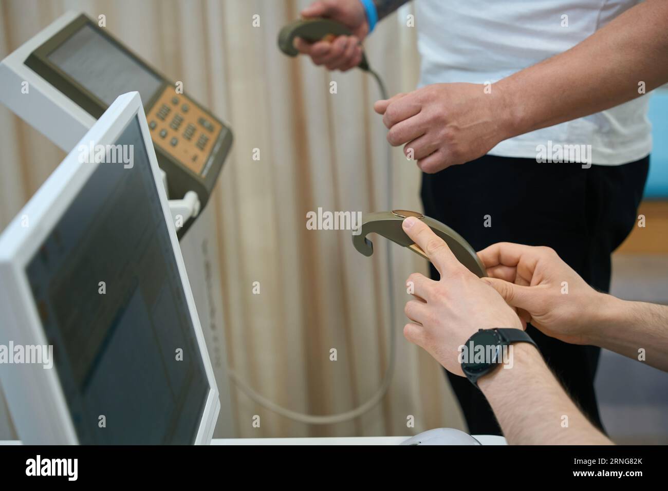 Doctor getting patient ready for body composition analysis Stock Photo ...