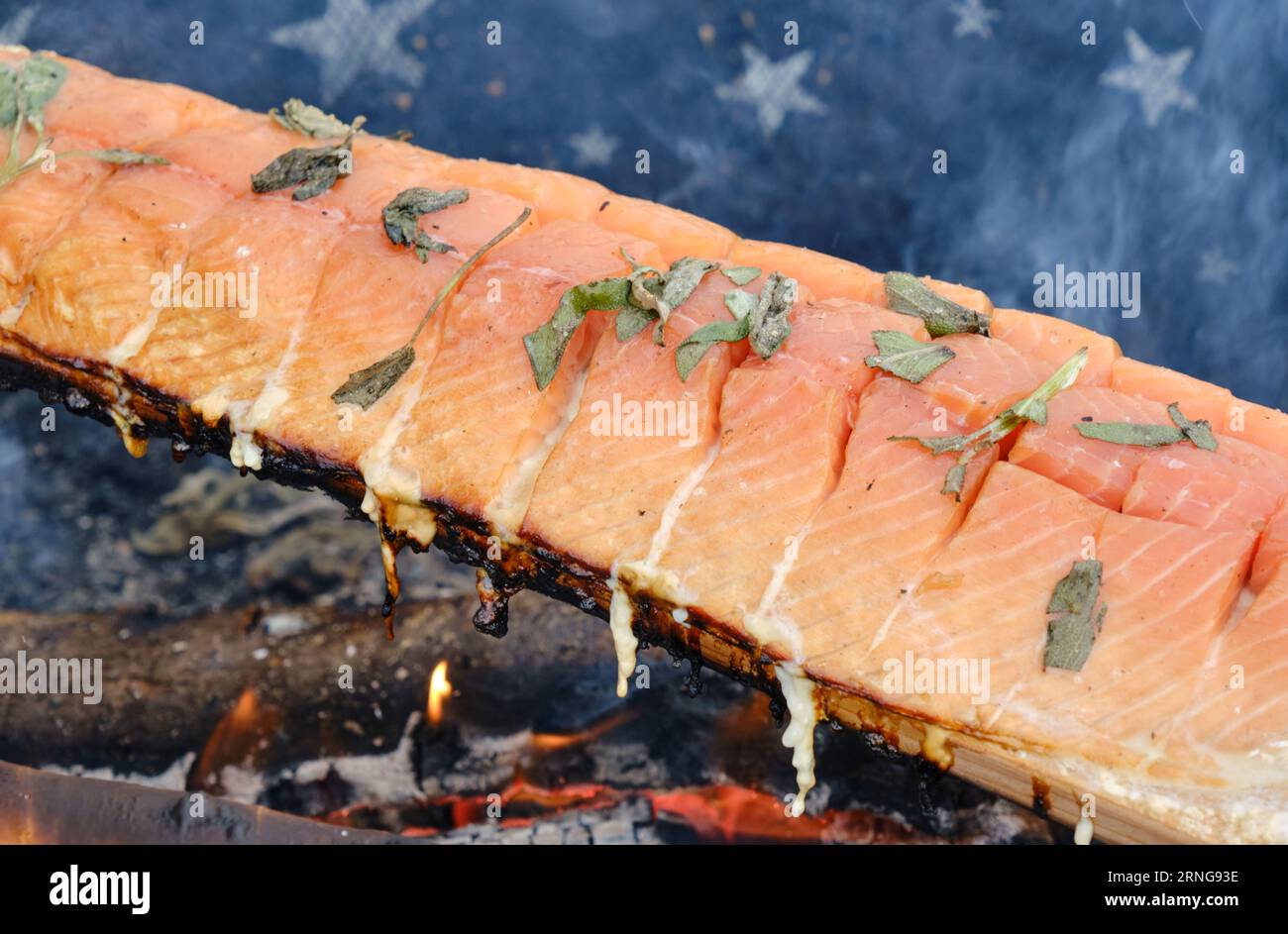 Traditional Indigenous preparation of salmon filet with maple glaze ...