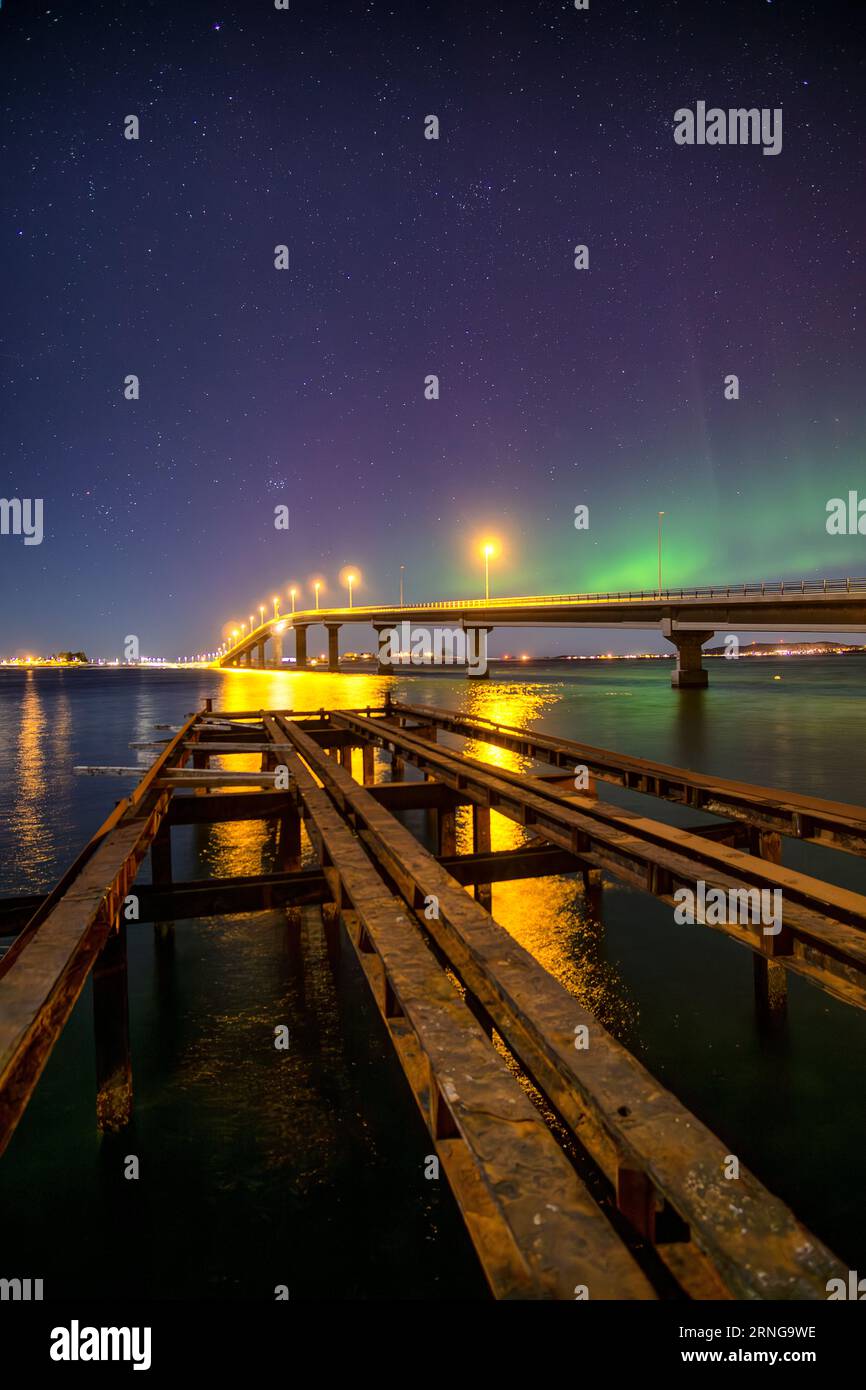 The Northern Lights over Giske bridge from Valderøya, Ålesund, Norway ...