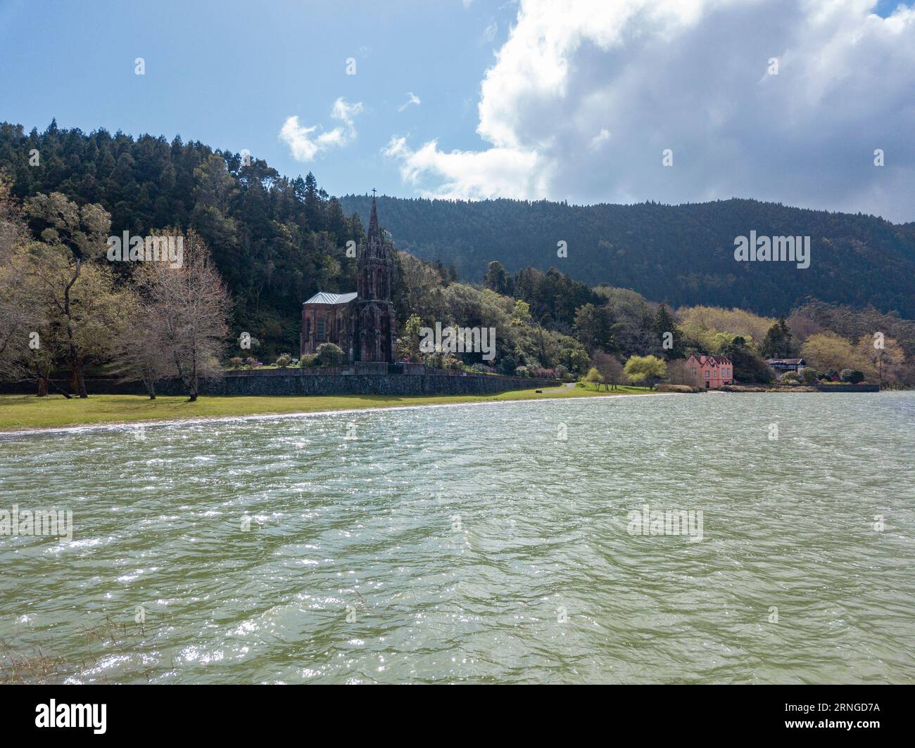 Scenery of Furnas lake and the chapel Nossa Senhora das Vitorias ...