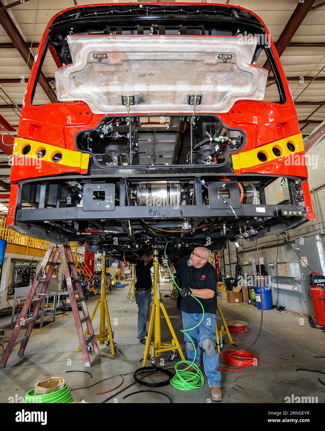(160925) -- LANCASTER, Sept. 25, 2016 -- People work at a BYD electric ...