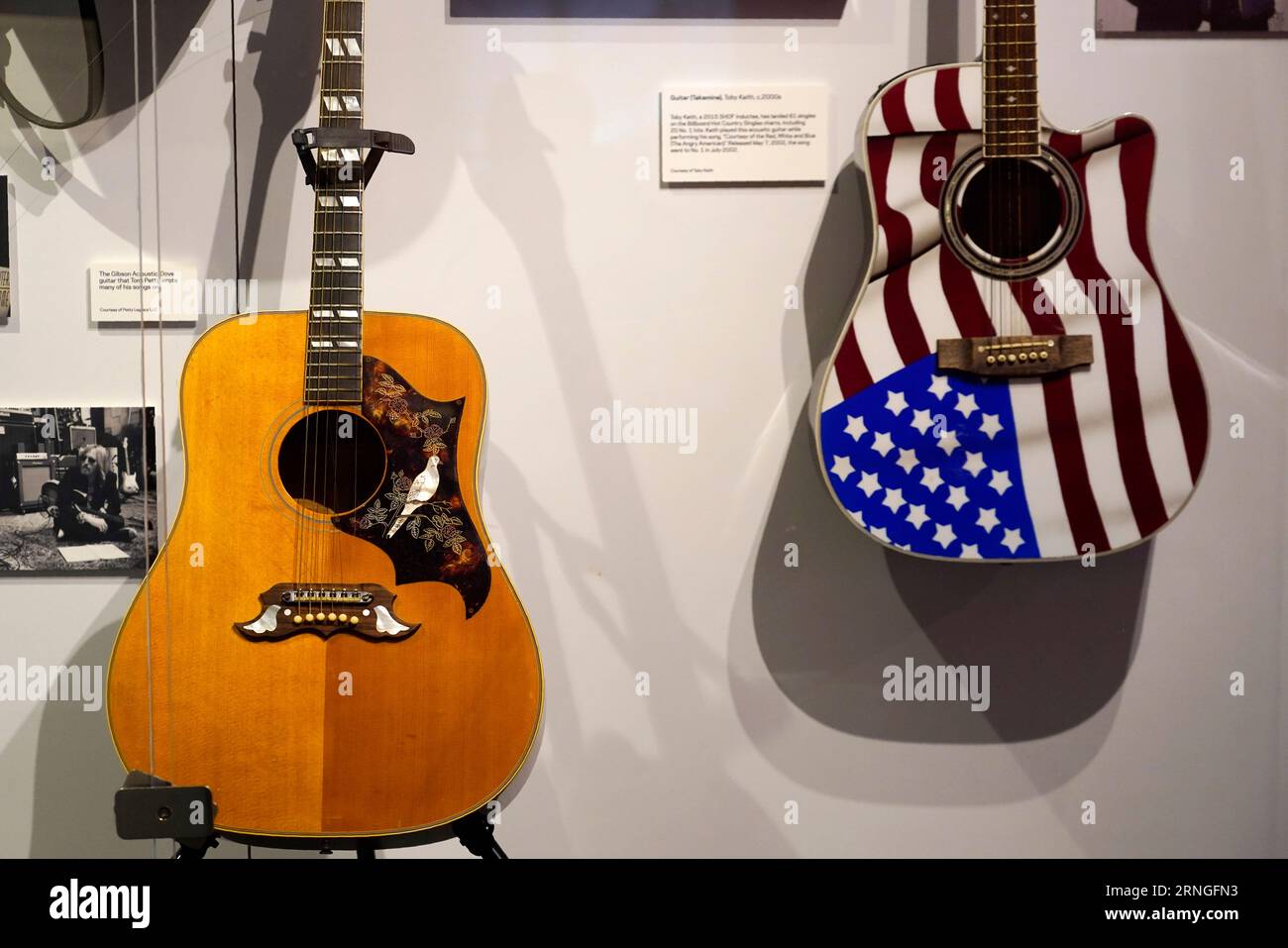 Guitars that were played by musicians Tom Petty, left, and Toby Keith ...