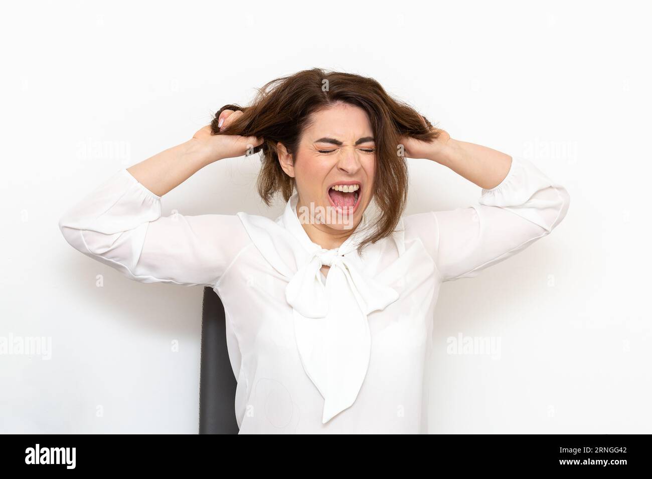 Scene of anger and hysterism of an employee who has a nervous crisis ...