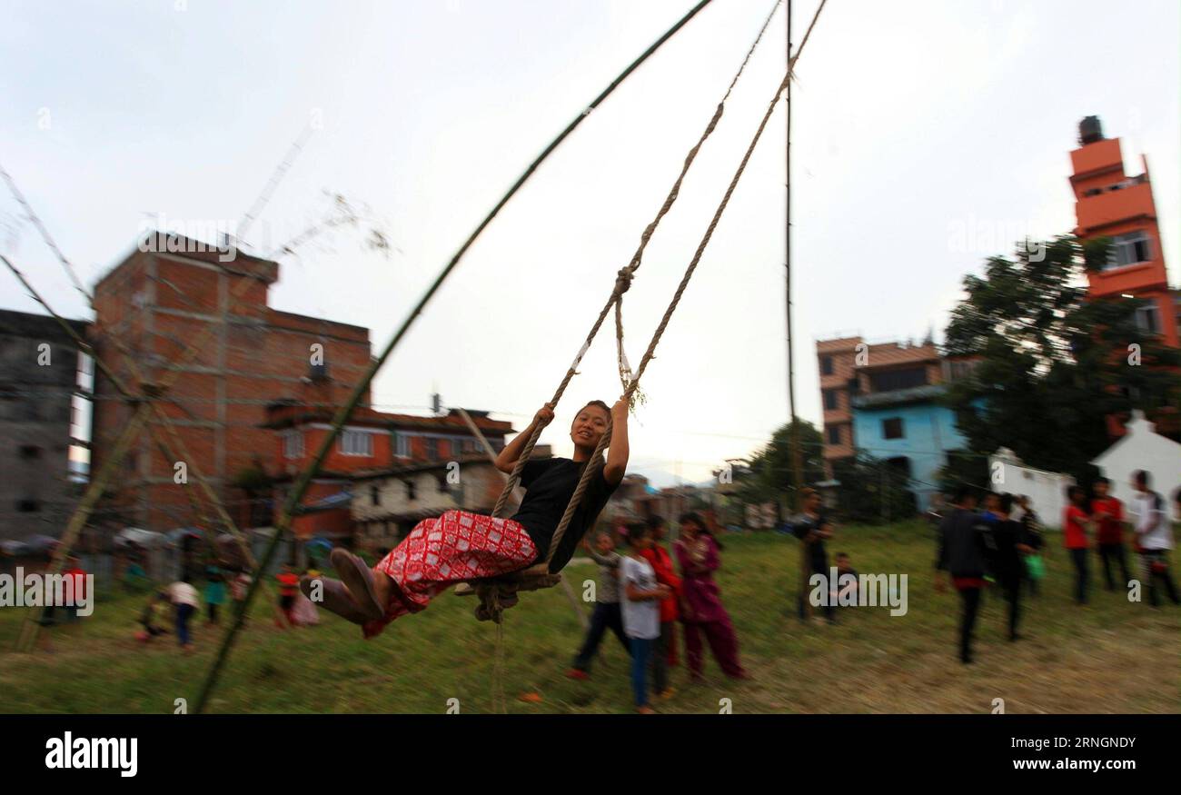 (161008) -- KATHMANDU, Oct. 7, 2016 -- A Nepali girl enjoys a ride on a ...