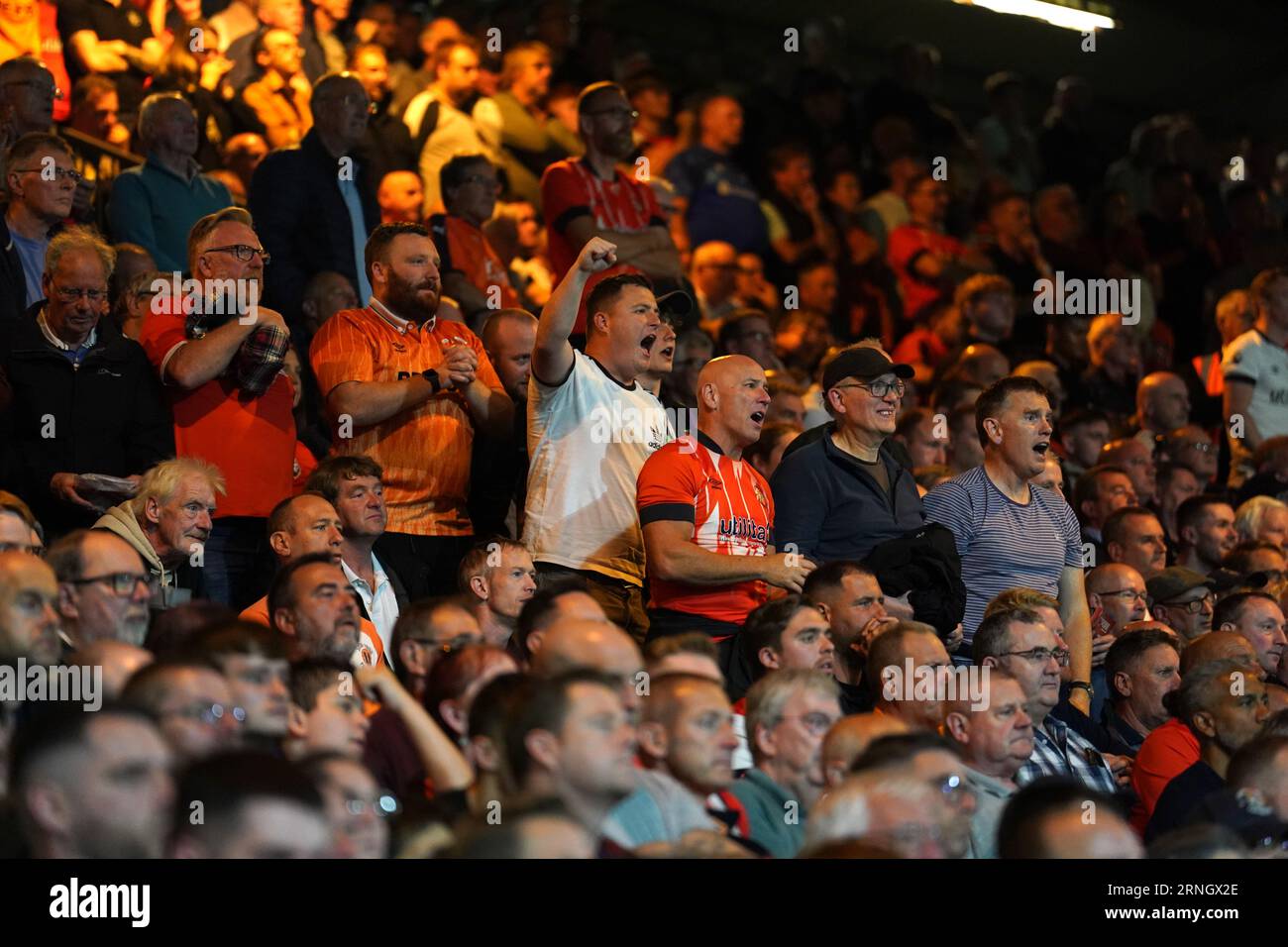 Luton fans celebrate their side's first goal of the game, scored by ...
