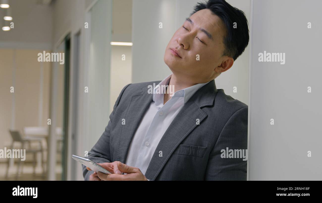 Tired businessman using mobile phone hi-res stock photography and ...