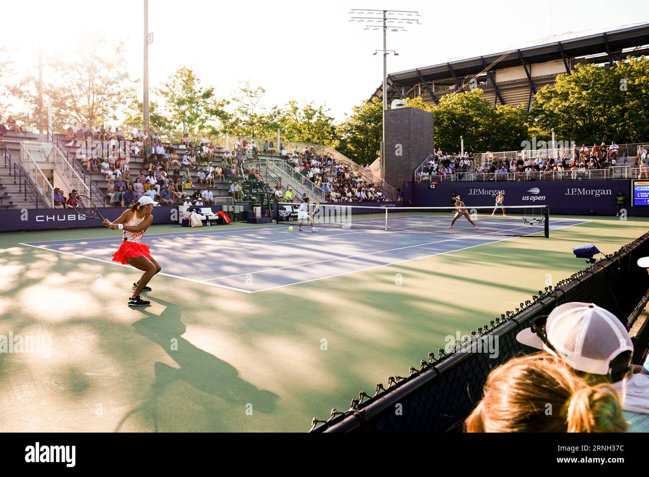 Jasmine Paolini and Xiyu Wang in action against Veronika Kudermetova ...
