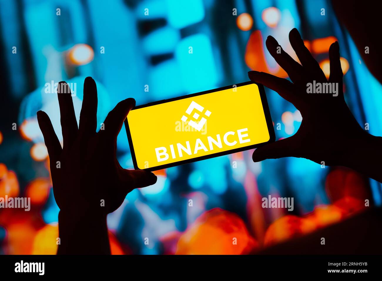 In this photo illustration, the Binance logo is displayed on a ...