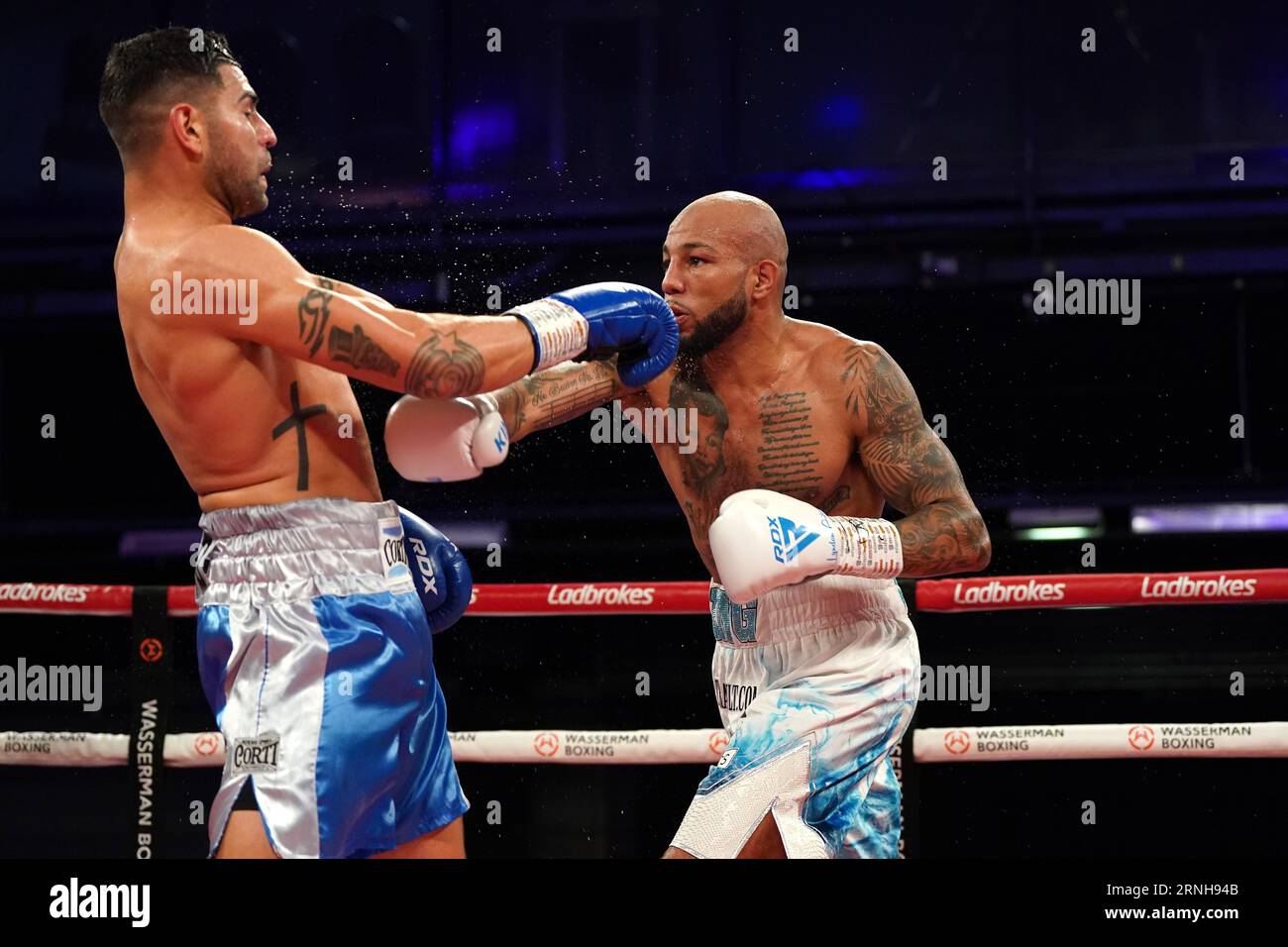 Lyndon Arthur (right) in action against Braian Nahuel Suarez in the IBO ...