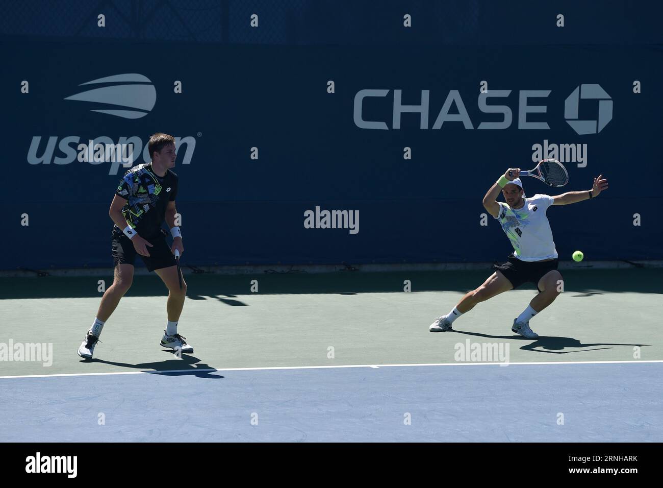 Julian Cash in action during a men's doubles match with Henry Patten at ...