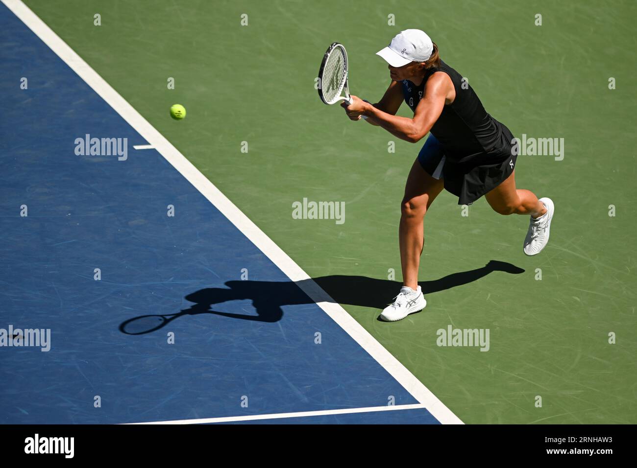 Iga Swiatek in action during a women's singles match at the 2023 US ...
