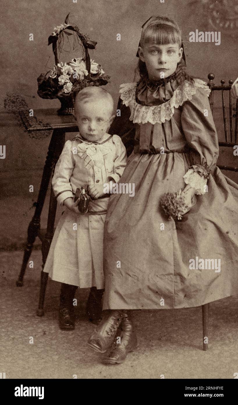 A 19th century photography studio portrait of well-dressed American ...