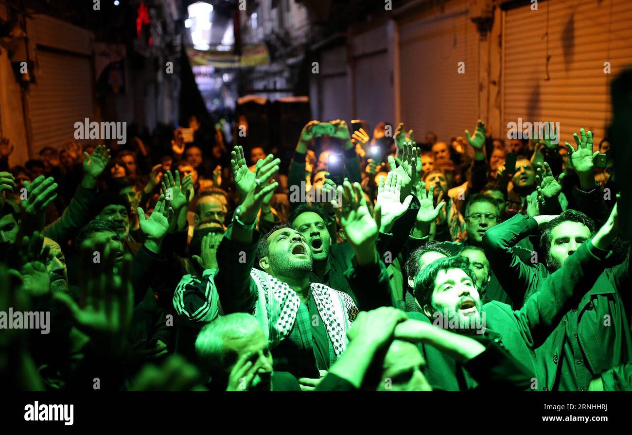 Shiite Muslims attend a procession as they observe the Arbaeen festival ...