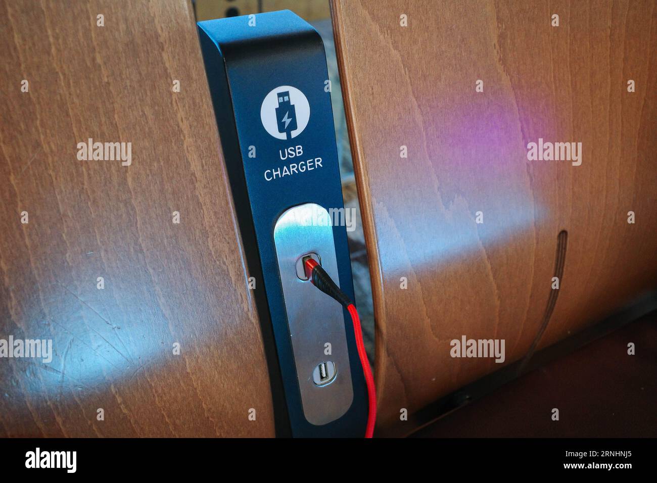 Close up of a USB charger affixed on a chair at an airport in Singapore ...