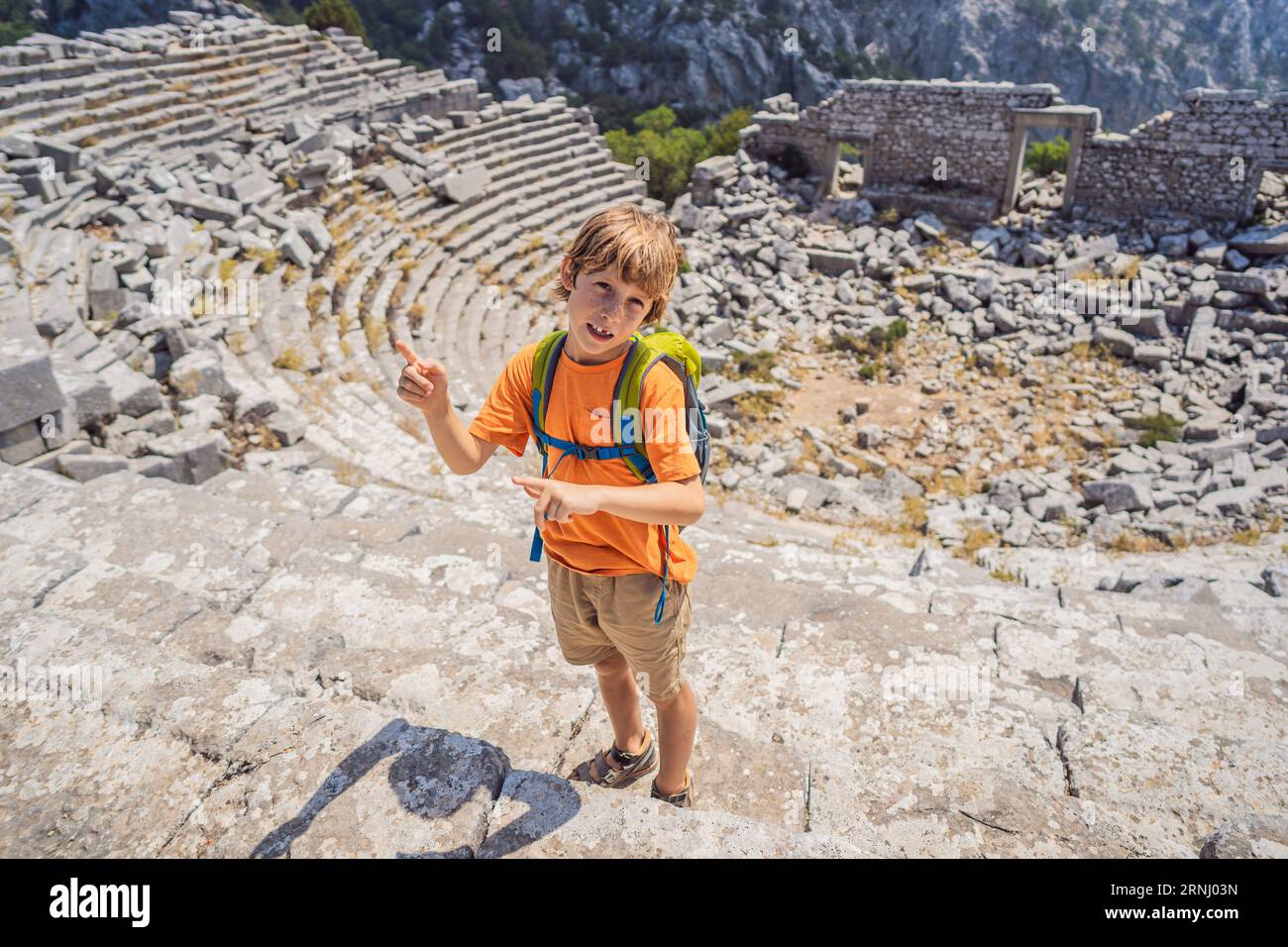 boy explores Stunning Ancient Theater of Termessos Ancient City ...