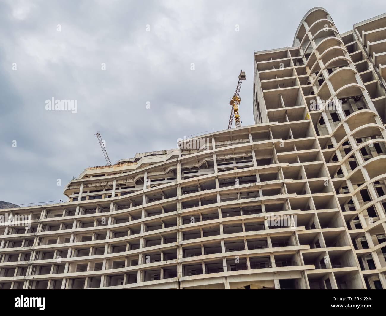 Massive concrete house taking shape, a work in progress. Construction site showcases modern ...