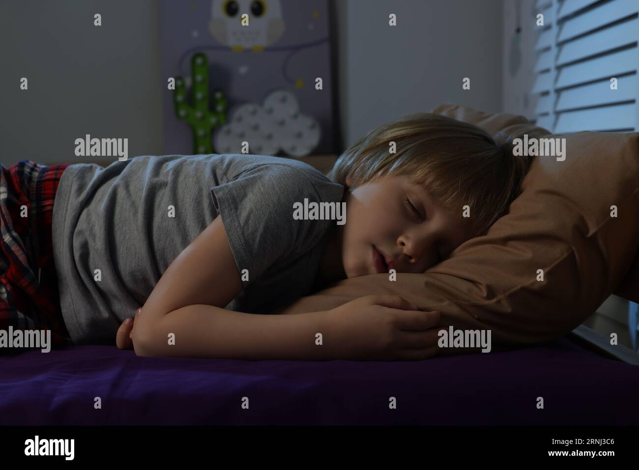 Little boy snoring while sleeping in bed at night Stock Photo - Alamy