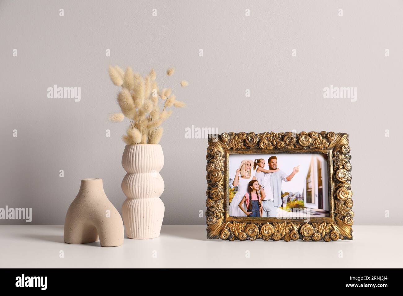 Vintage square frame with family photo and other decor elements on ...