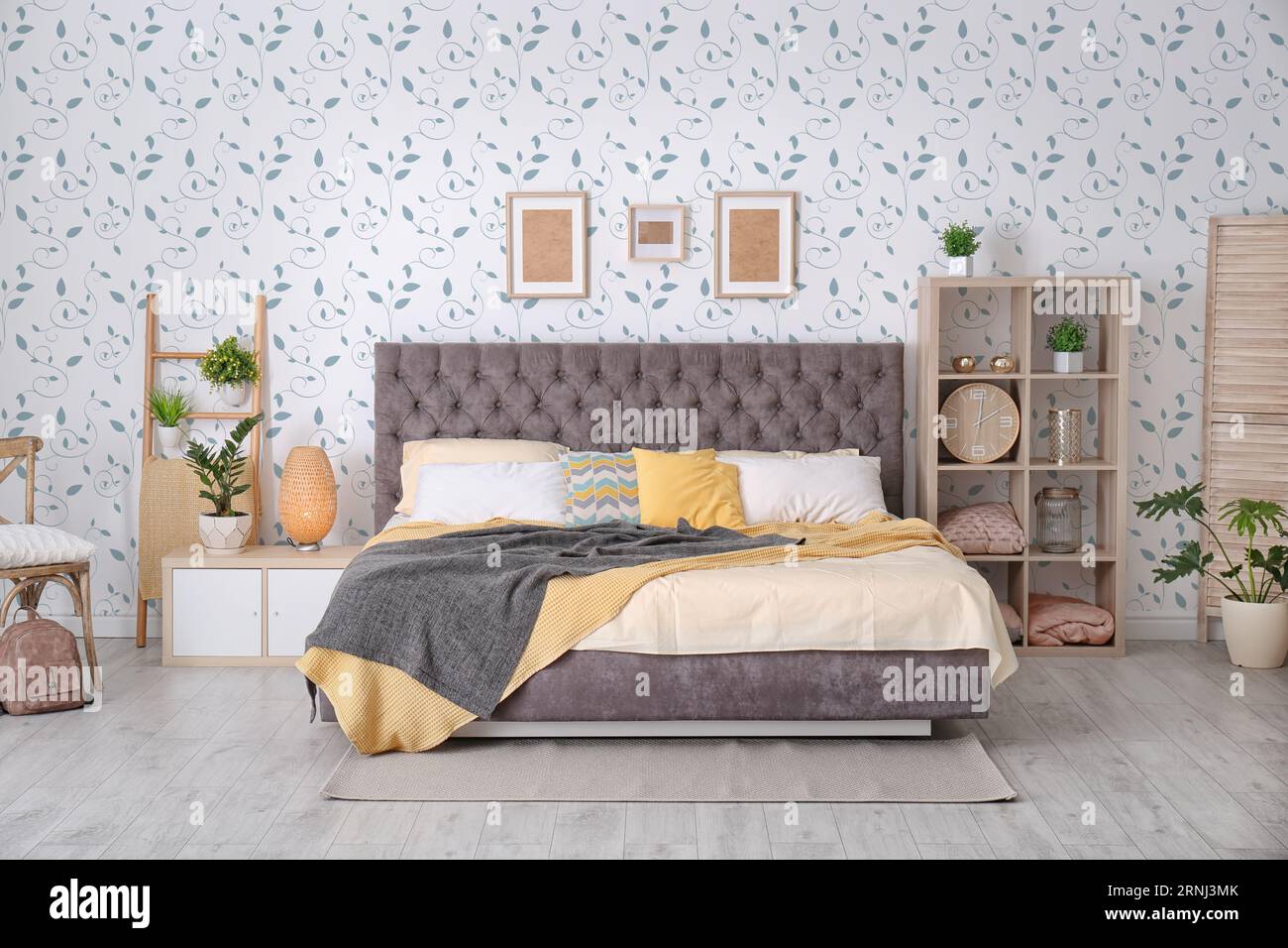 Cozy bedroom interior with comfortable large bed Stock Photo - Alamy