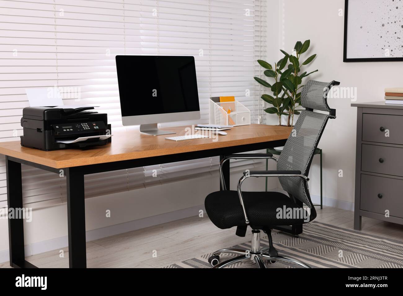 Stylish room interior with desk, modern printer and computer Stock ...