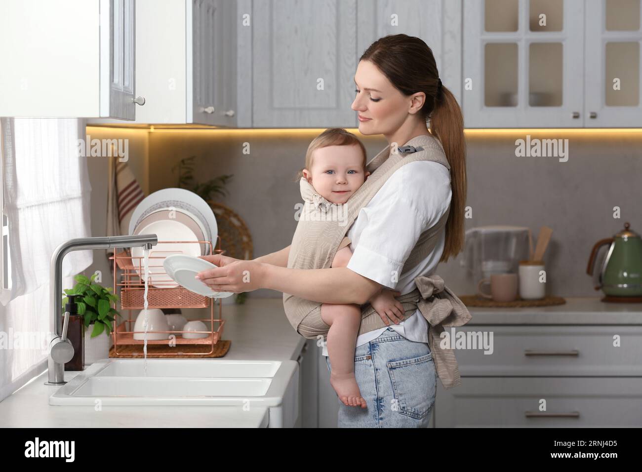 Mother washing newborn baby hi-res stock photography and images - Alamy