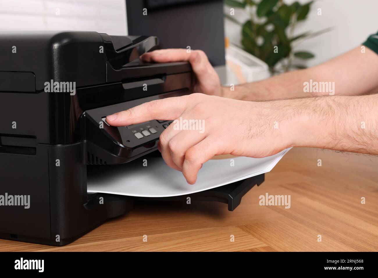 Person using black printer at home hi-res stock photography and images ...