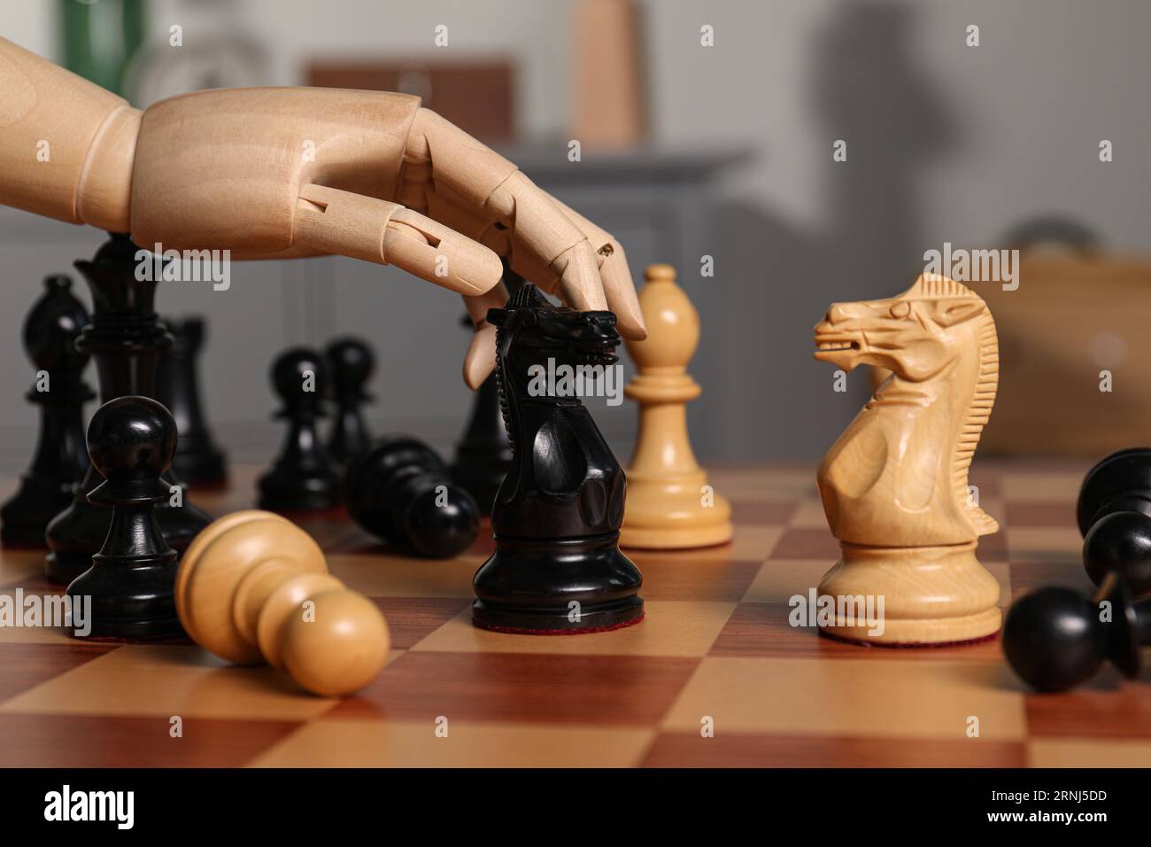 Robot moving chess piece on board, closeup. Wooden hand representing ...